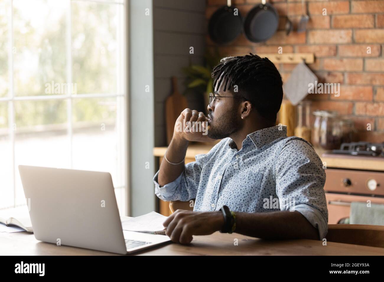 Thoughtful distance employee looking at window in deep thought Stock ...