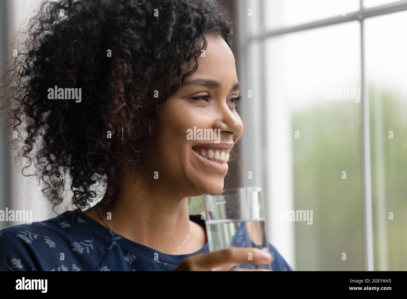 Black woman drinking water hi-res stock photography and images - Alamy