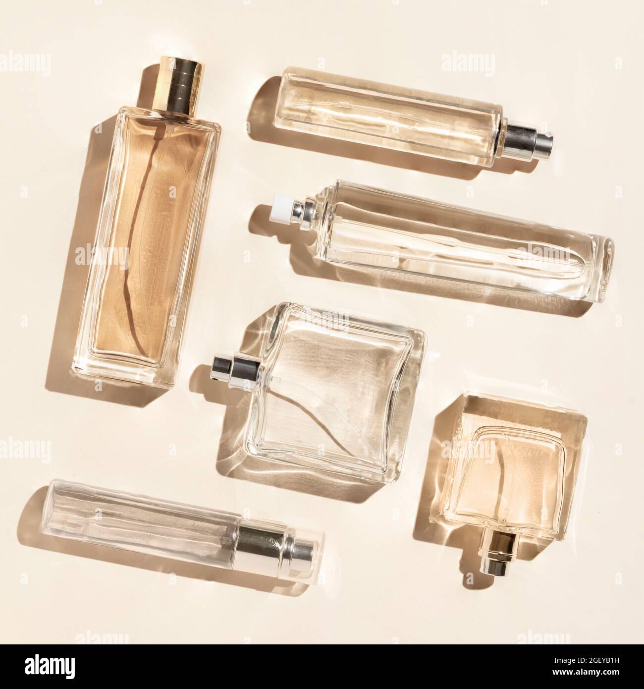 perfume bottles of beige color. Flatlay still life in the style of ...