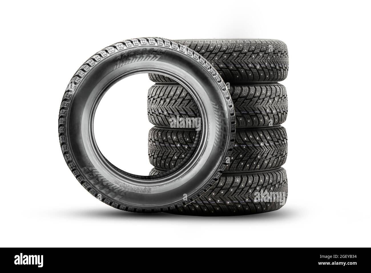 winter directional studded tires isolate, set stack on a white ...