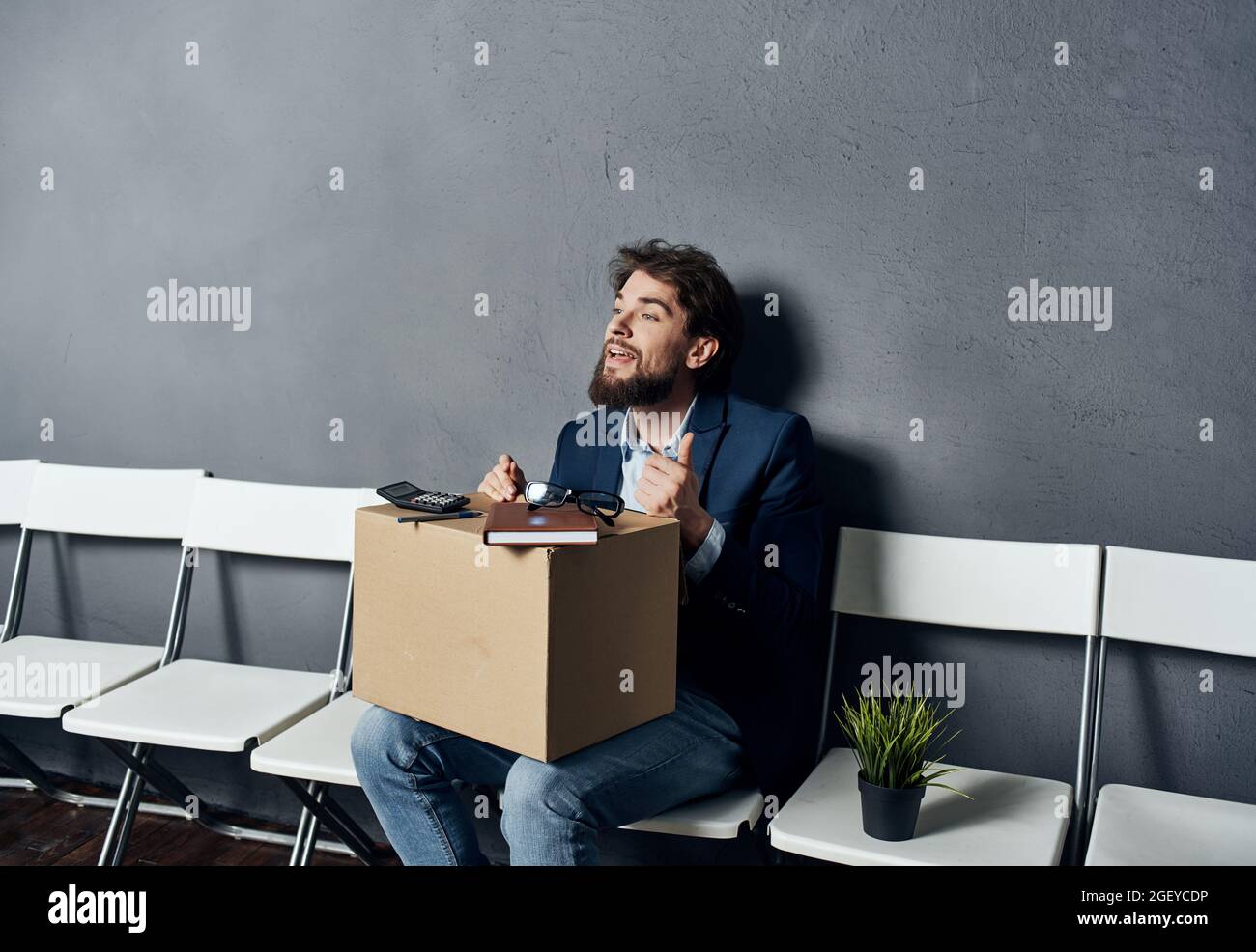 emotional male manager box with things being fired from work Stock ...