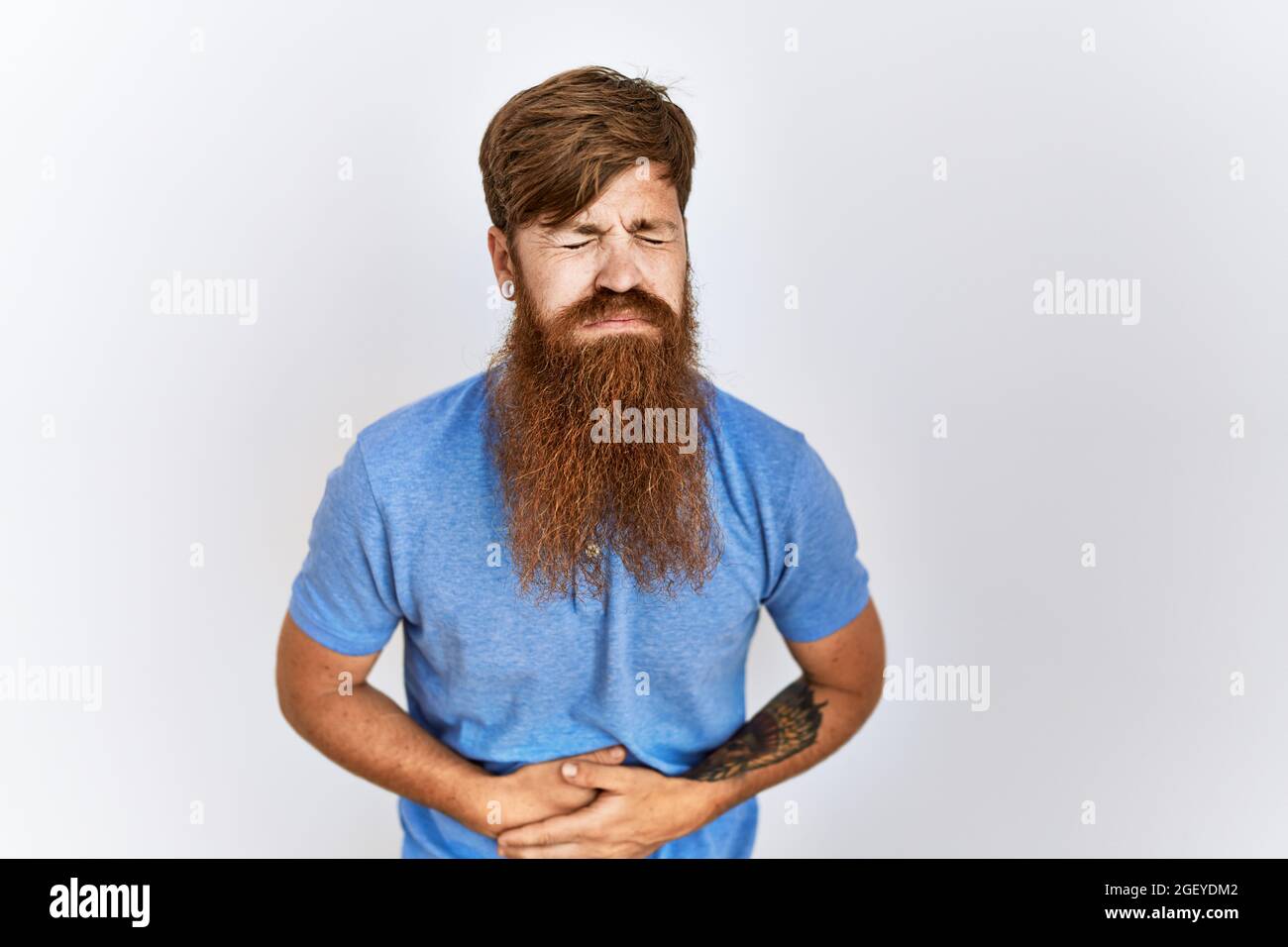 Caucasian man with long bear standing over isolated background with ...