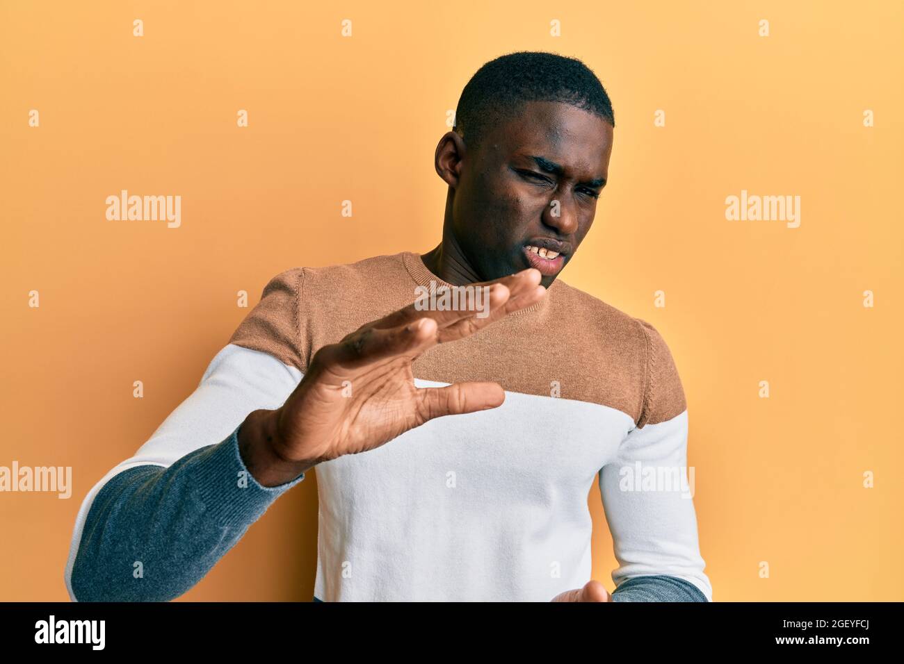 Young african american man wearing casual clothes disgusted expression ...