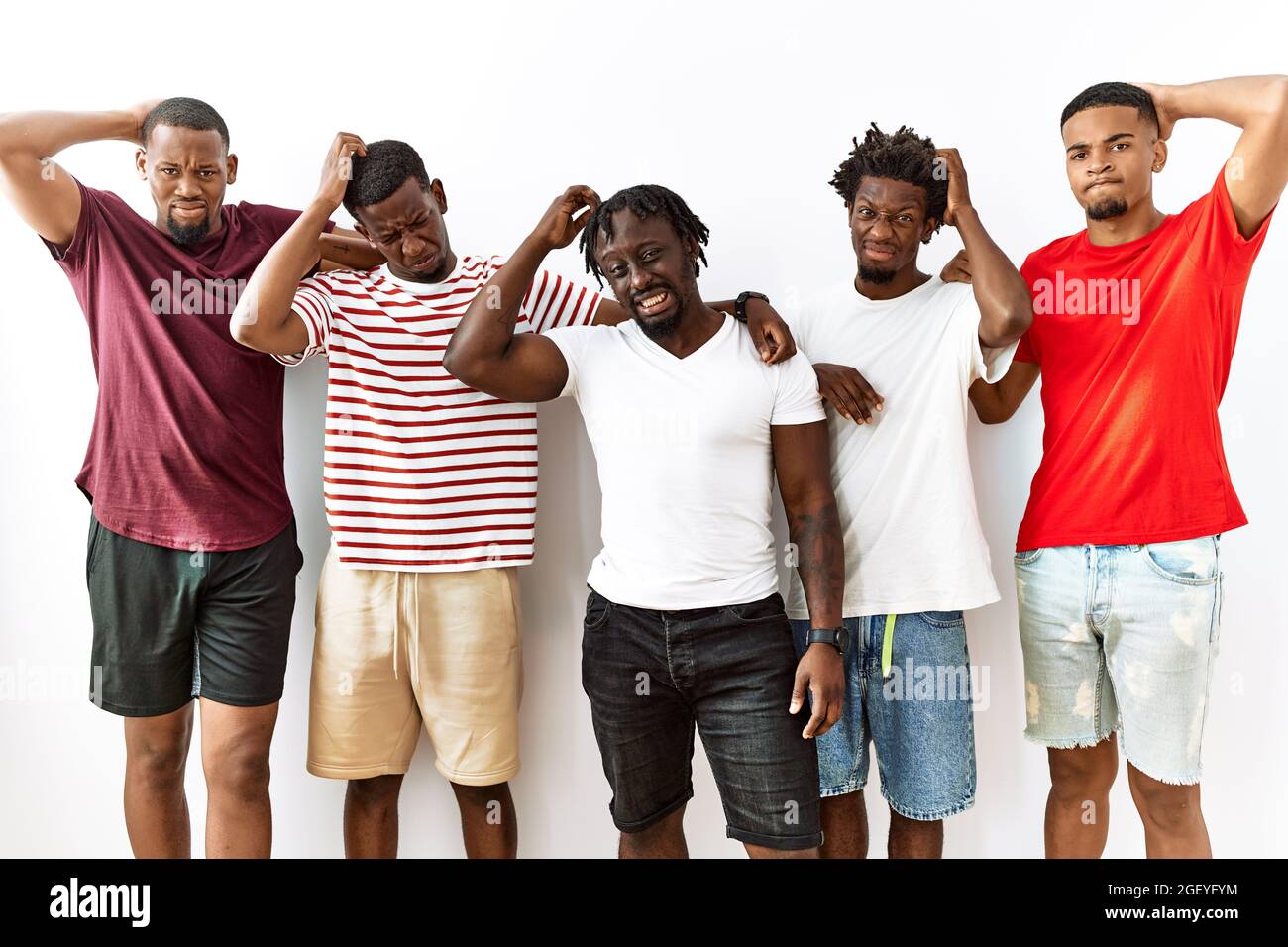 Young african group of friends standing together over isolated ...