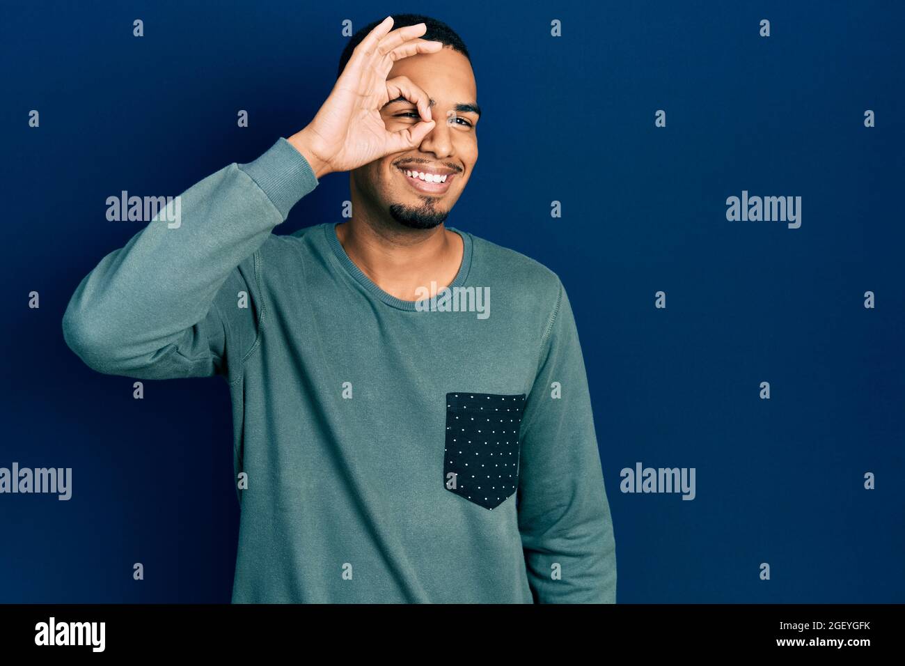 Young african american man wearing casual clothes smiling happy doing ...