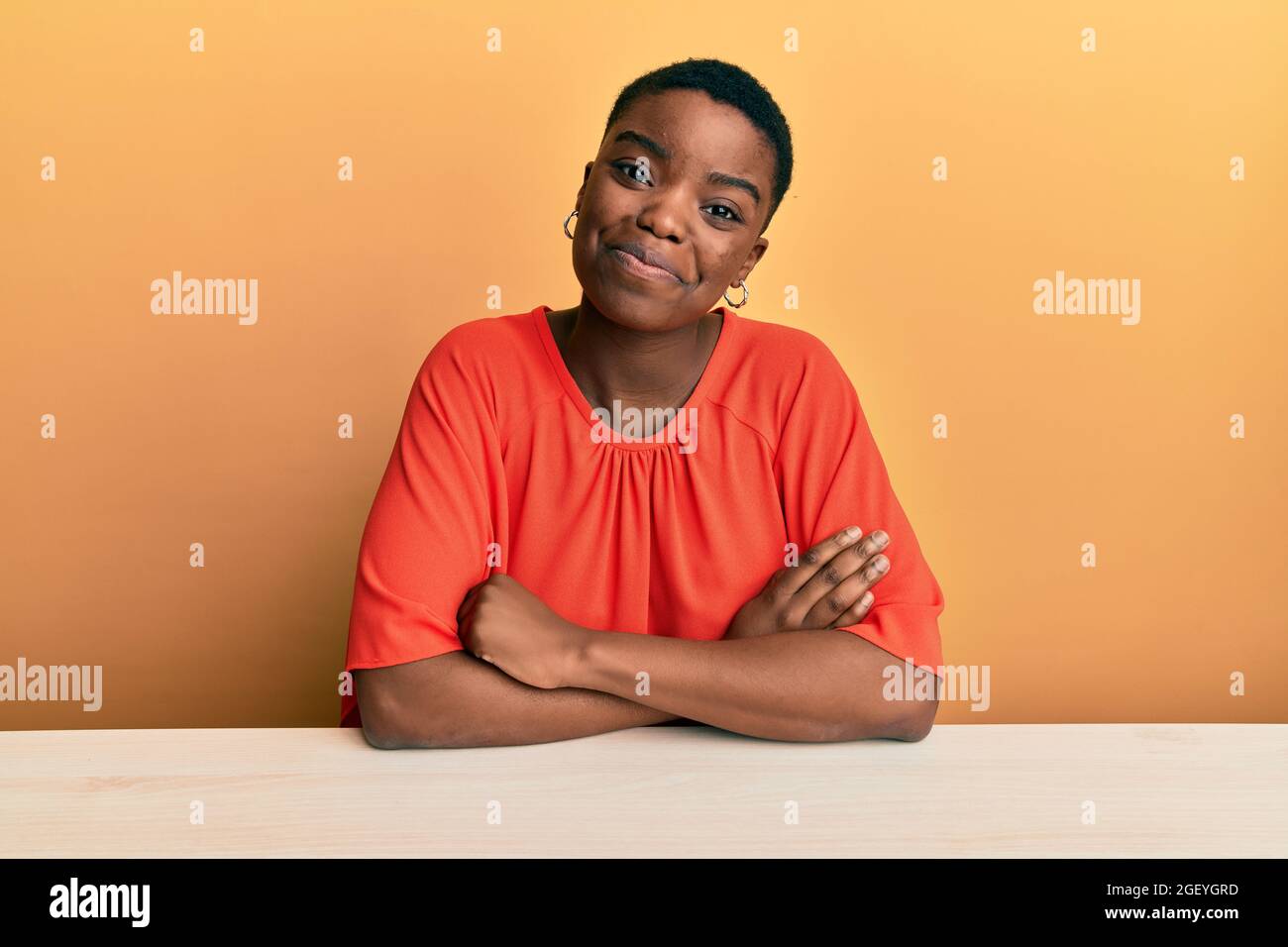 Young african american woman wearing casual clothes sitting on the ...