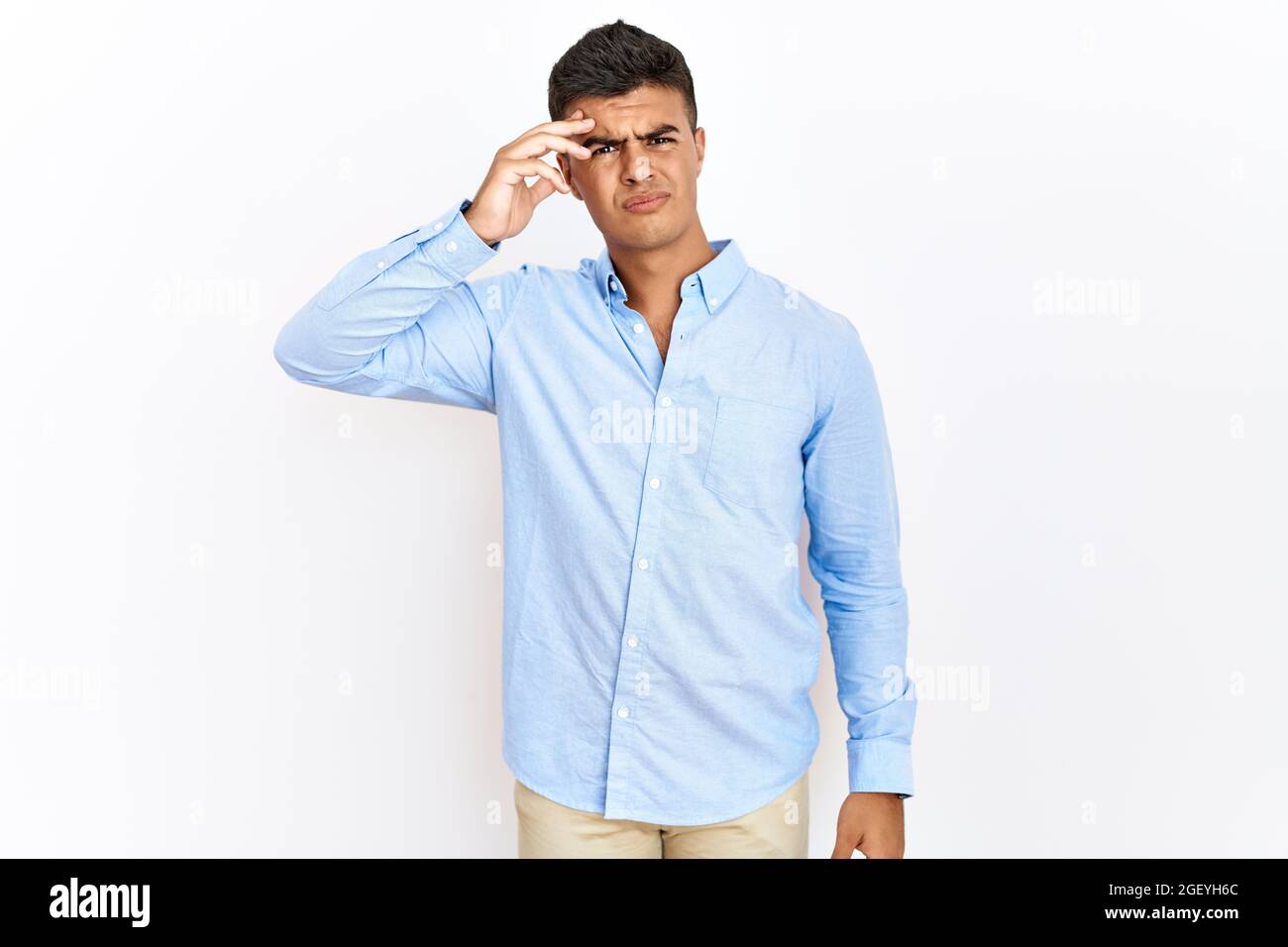 Young hispanic man wearing business shirt standing over isolated ...