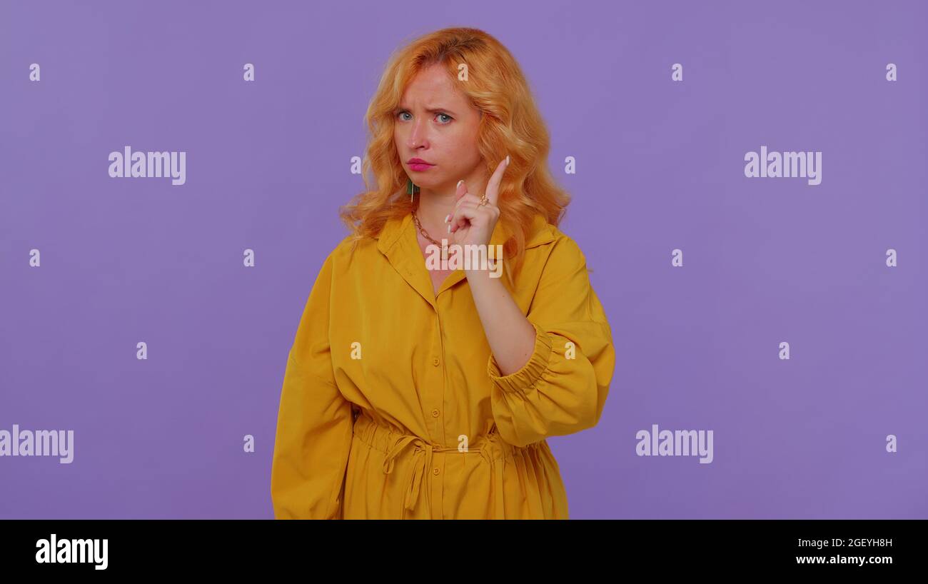 Girl shakes finger and saying no, be careful, scolding, giving advice ...