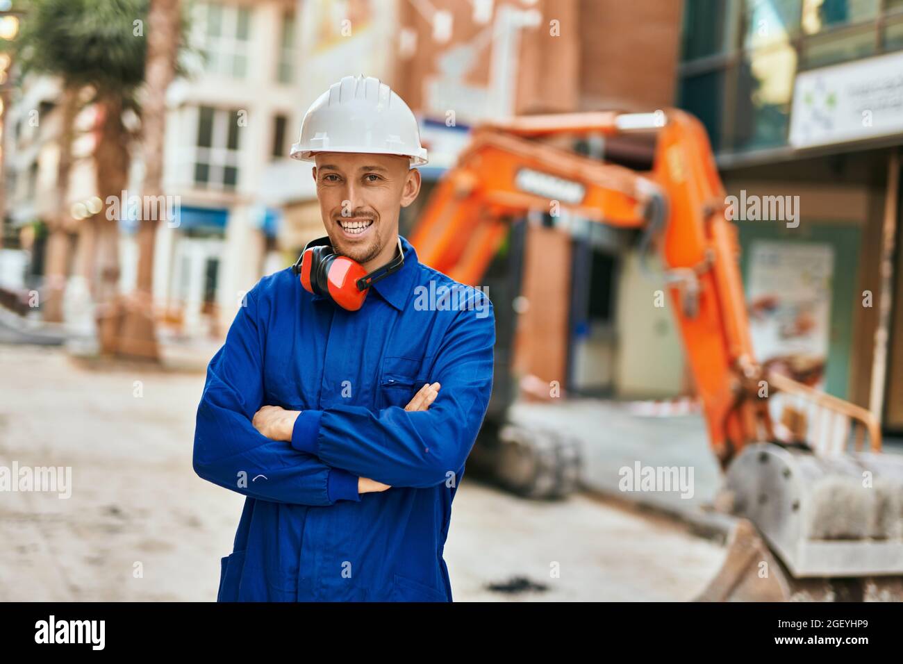 Young caucasian worker smiling happy wearing uniform at the city Stock ...
