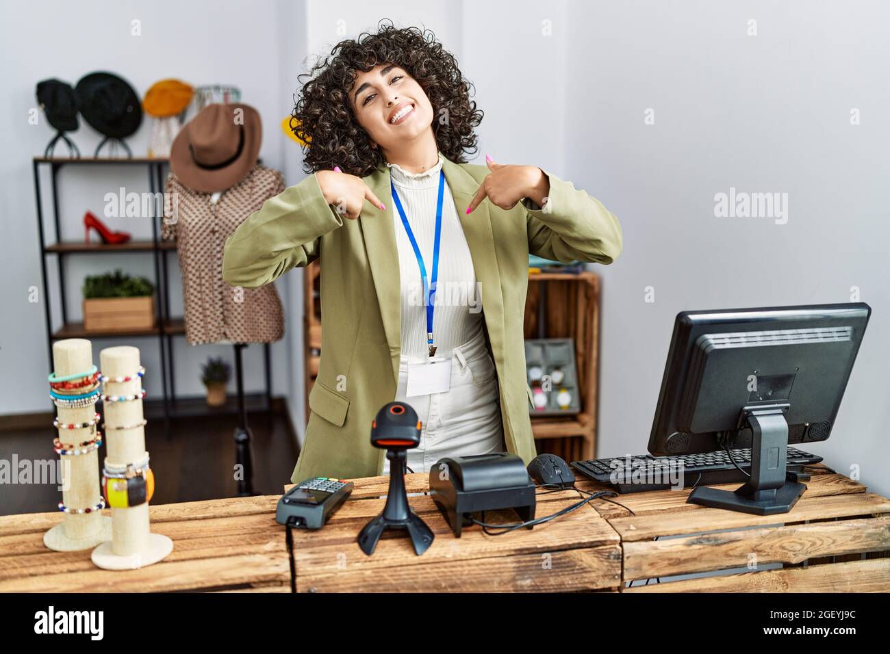 Young middle eastern woman working as manager at retail boutique ...