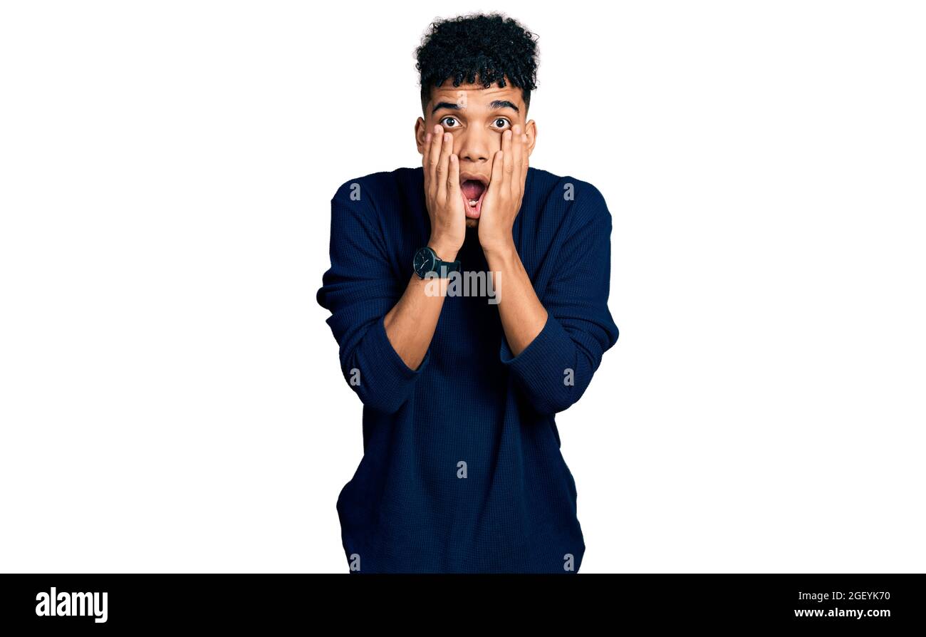 Young african american man wearing casual clothes afraid and shocked ...