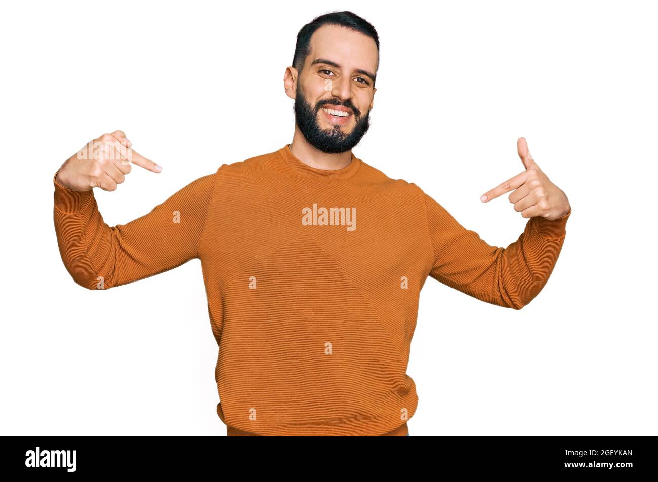 Young man with beard wearing casual winter sweater looking confident ...