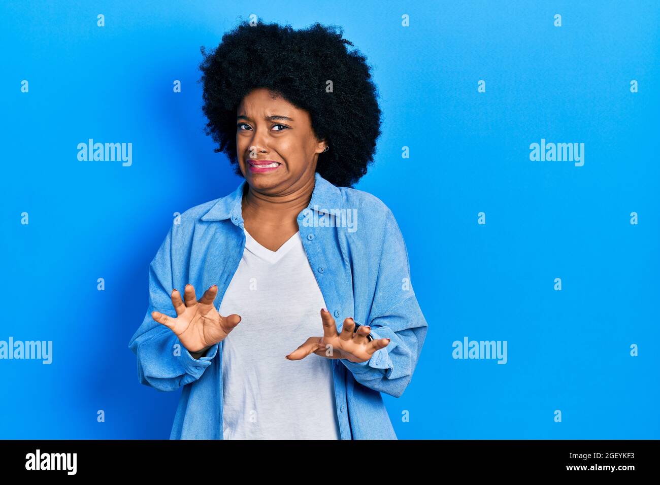 Young african american woman wearing casual clothes disgusted ...