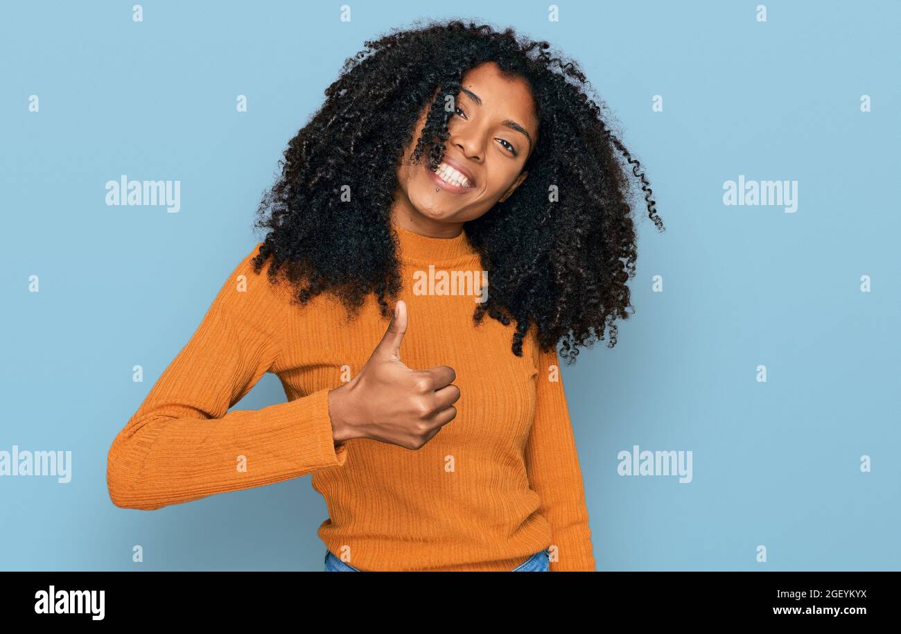Young african american girl wearing casual clothes doing happy thumbs ...