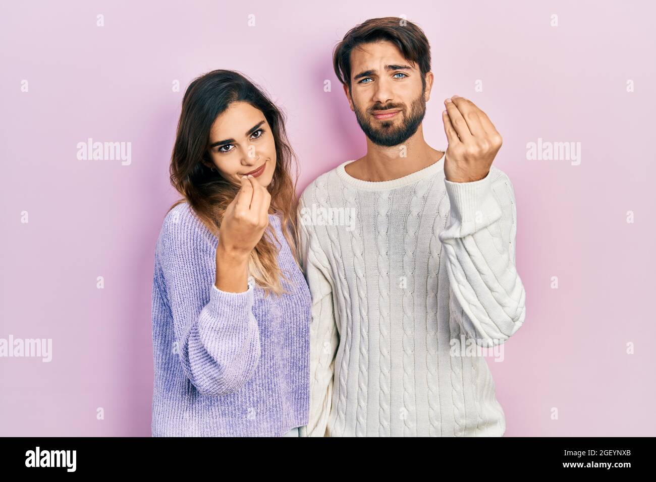 Young hispanic couple wearing casual clothes doing italian gesture with ...