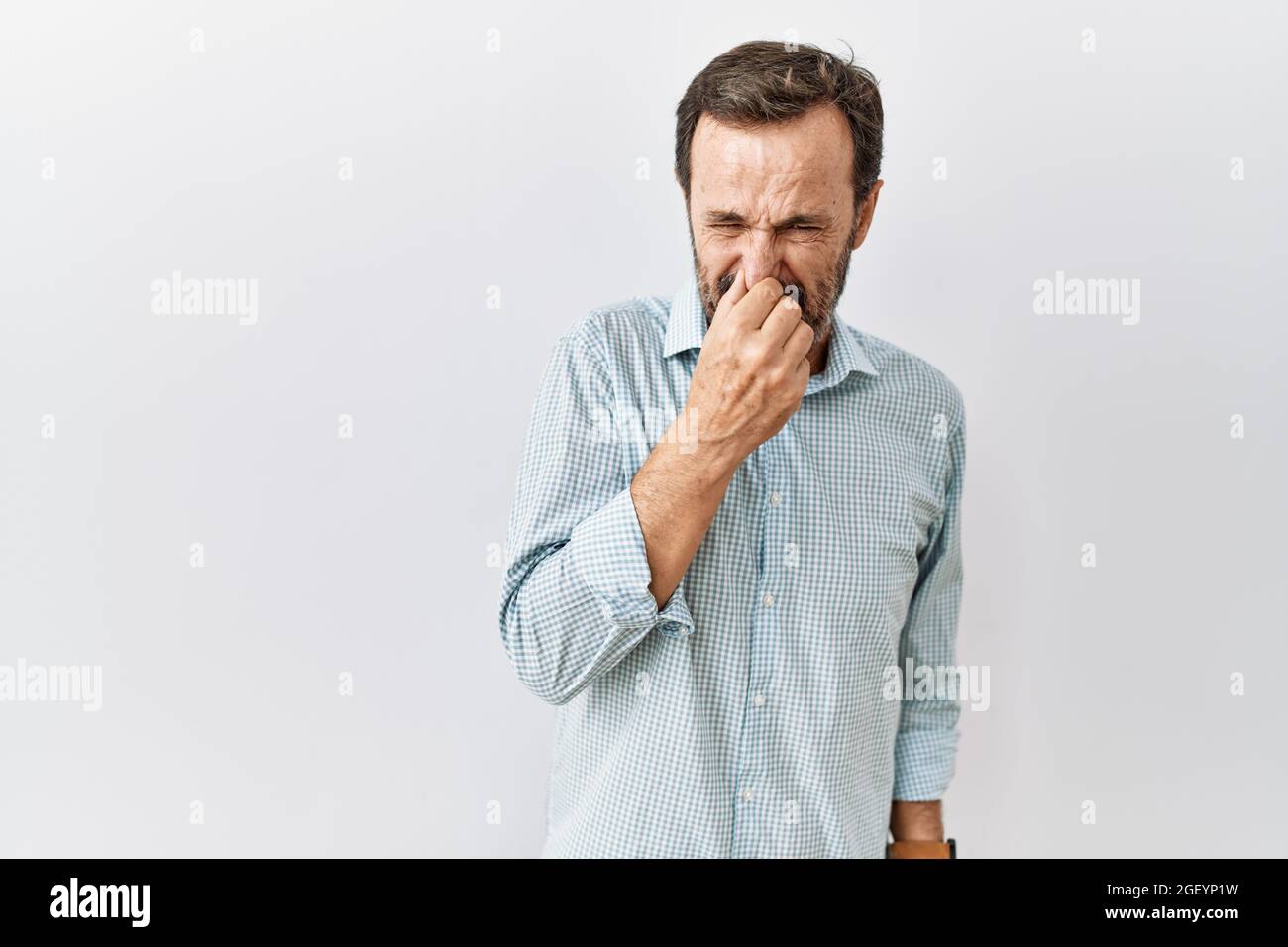 Middle age hispanic man with beard standing over isolated background ...