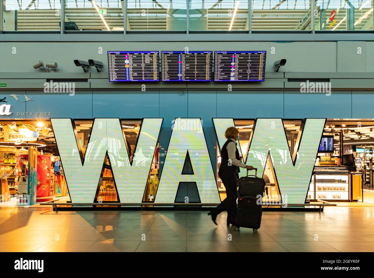 A picture of the WAW sign inside the Warsaw Chopin Airport while ...