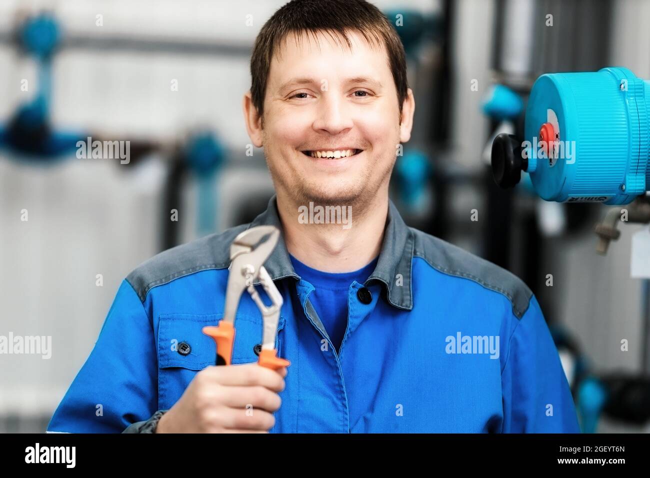 Man in boiler room working hi-res stock photography and images - Alamy