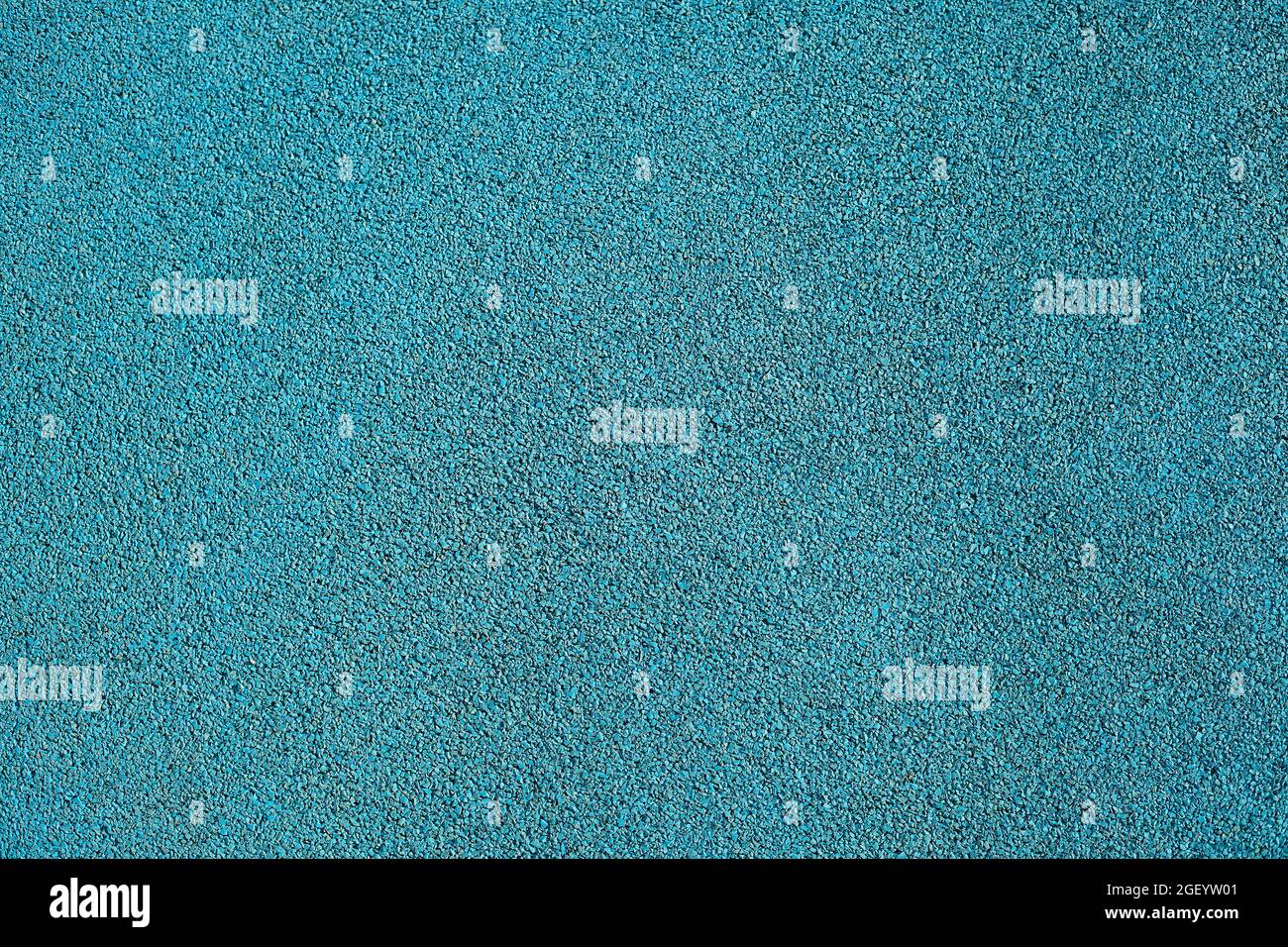 Background texture of blue crumb rubber used for athletic tracks and ...