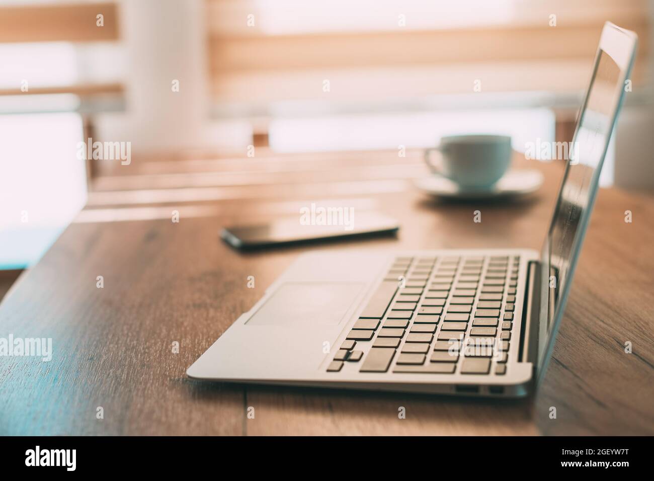 Home office workspace, laptop and smartphone on the desk in working ...