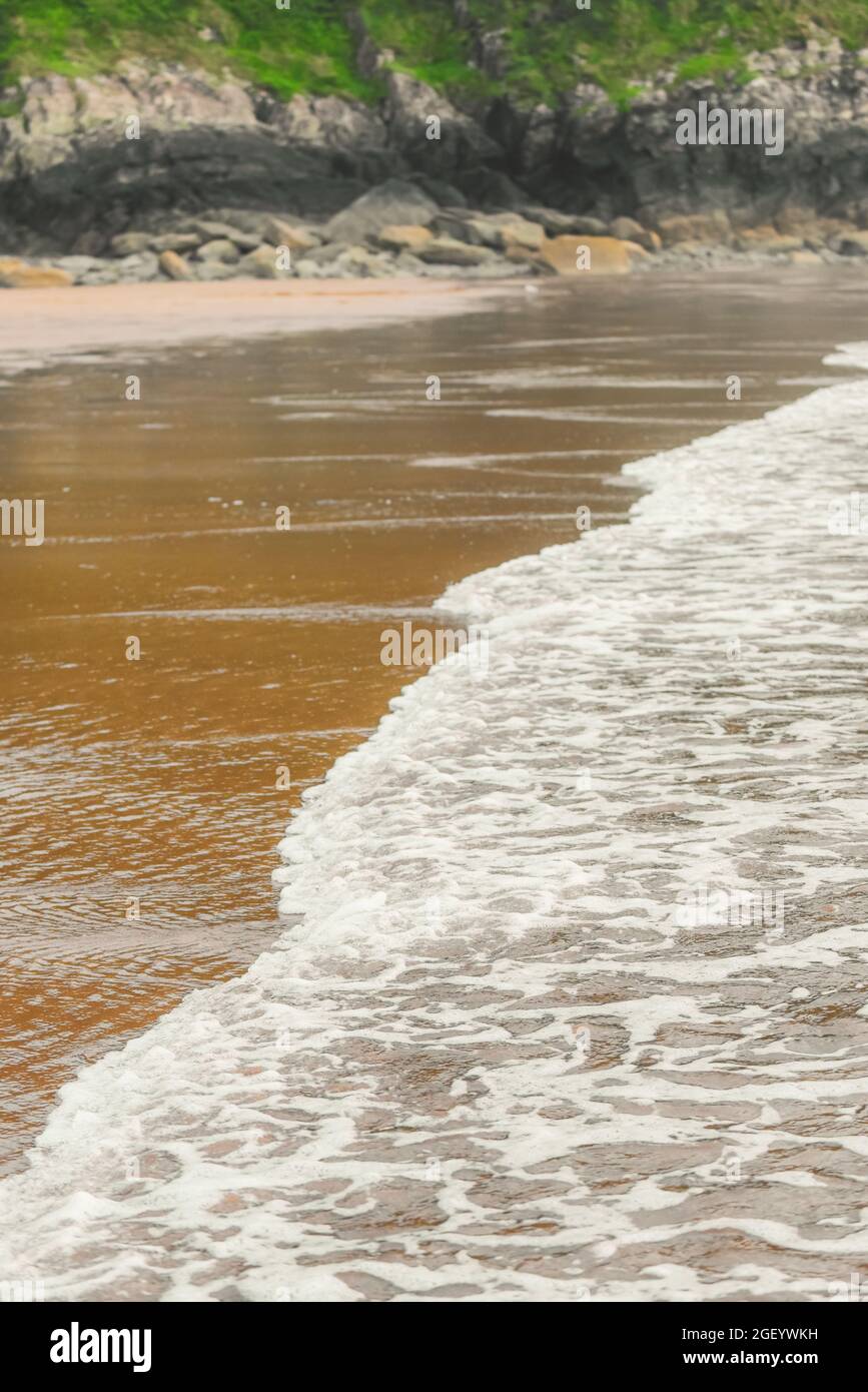Waves on sandy beach bubble hi-res stock photography and images - Alamy