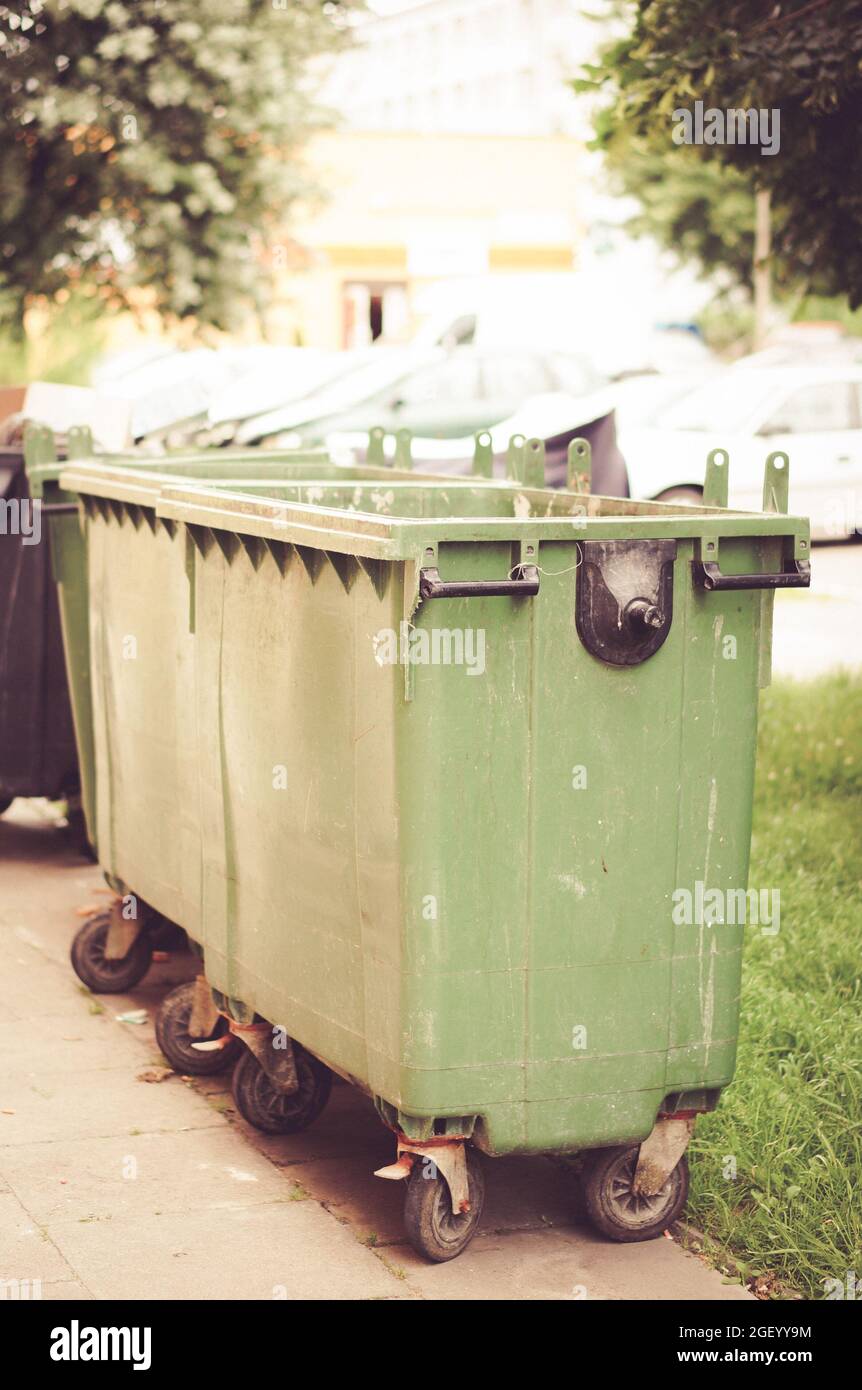 A vertical shot of garbage containers Stock Photo - Alamy