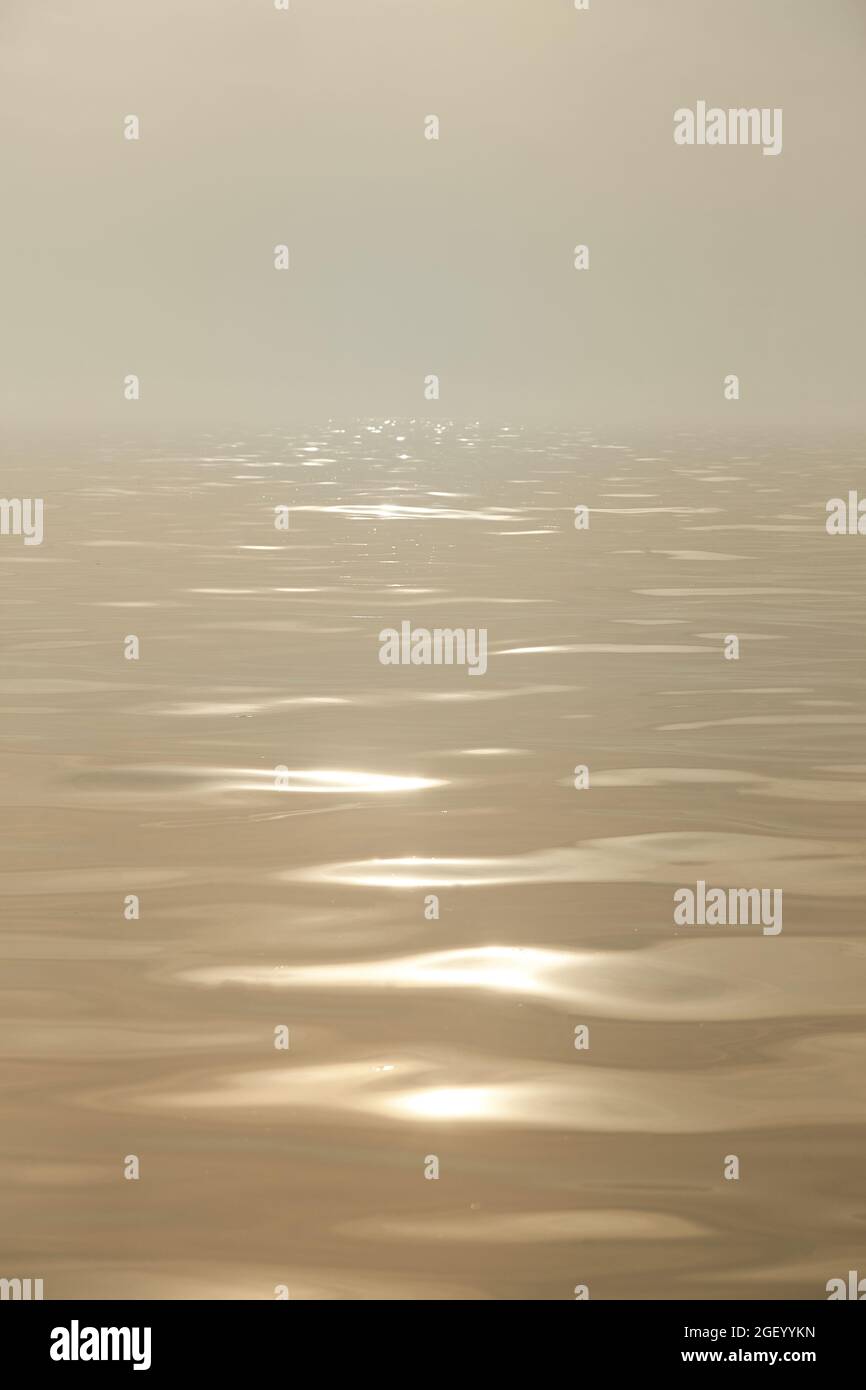 The sea in the fog. The line of the horizon, dissolving in the mist ...