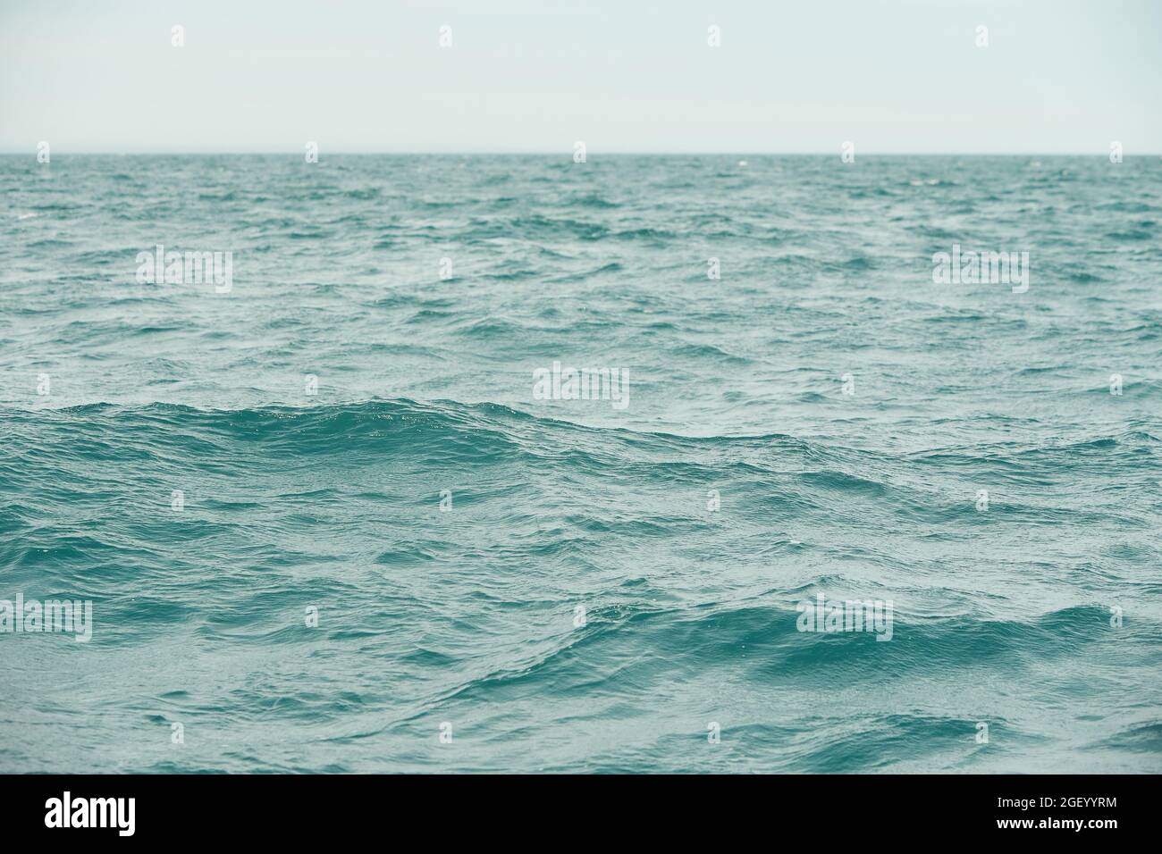Horizon sea with waves after storm. sparkler in water - background. sea ...
