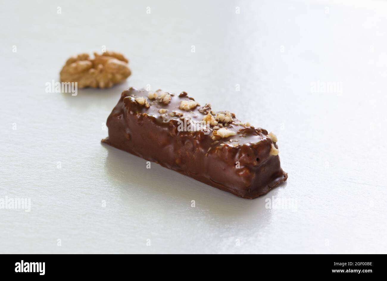 Homemade chocolate bar and walnut on white background Stock Photo - Alamy