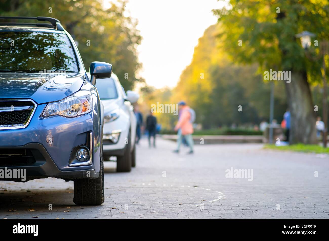 New clean car parked on a city street side Stock Photo - Alamy