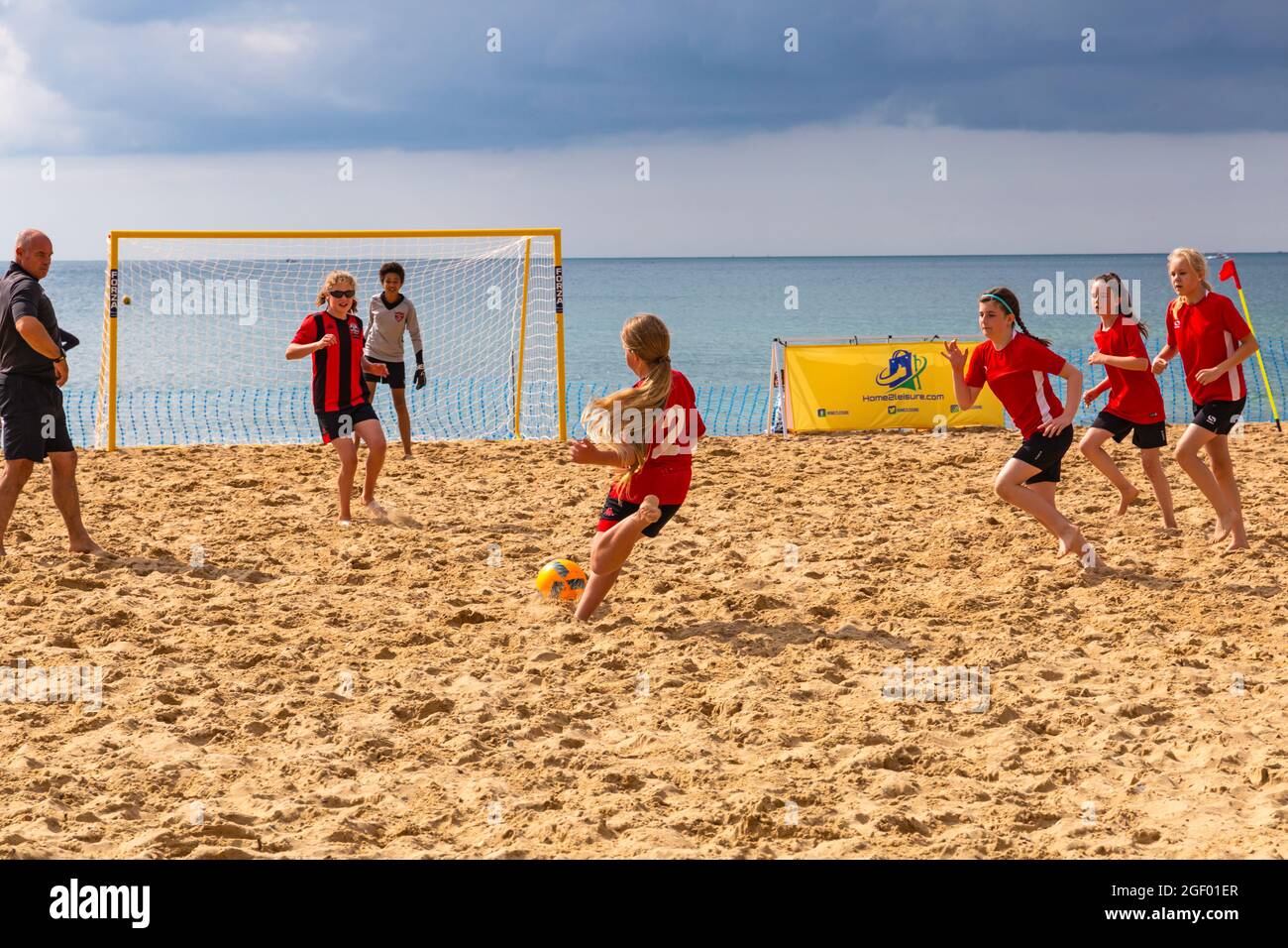 Kids playing soccer on a beach hi-res stock photography and images - Alamy