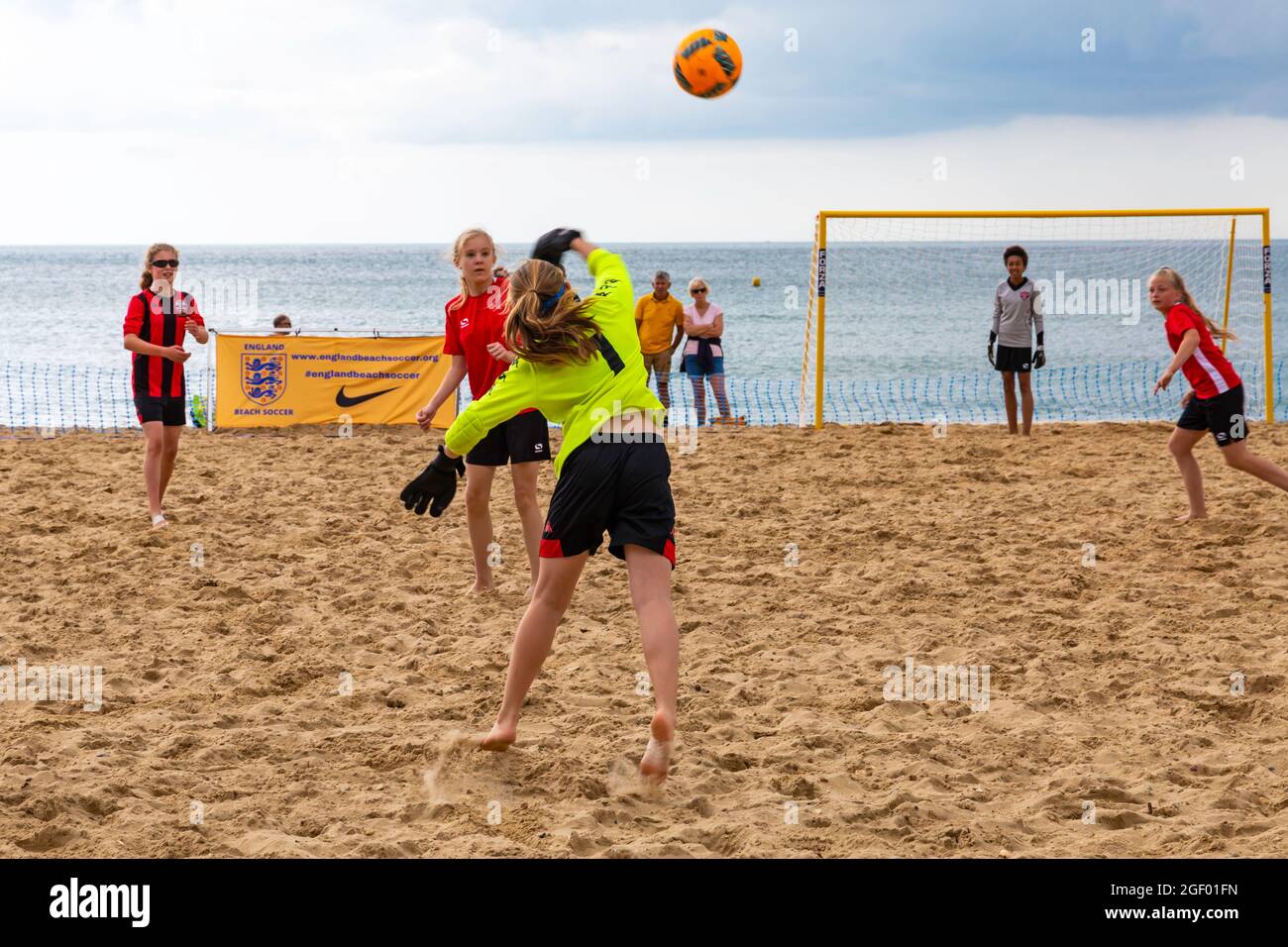 Kids playing soccer on a beach hi-res stock photography and images - Alamy