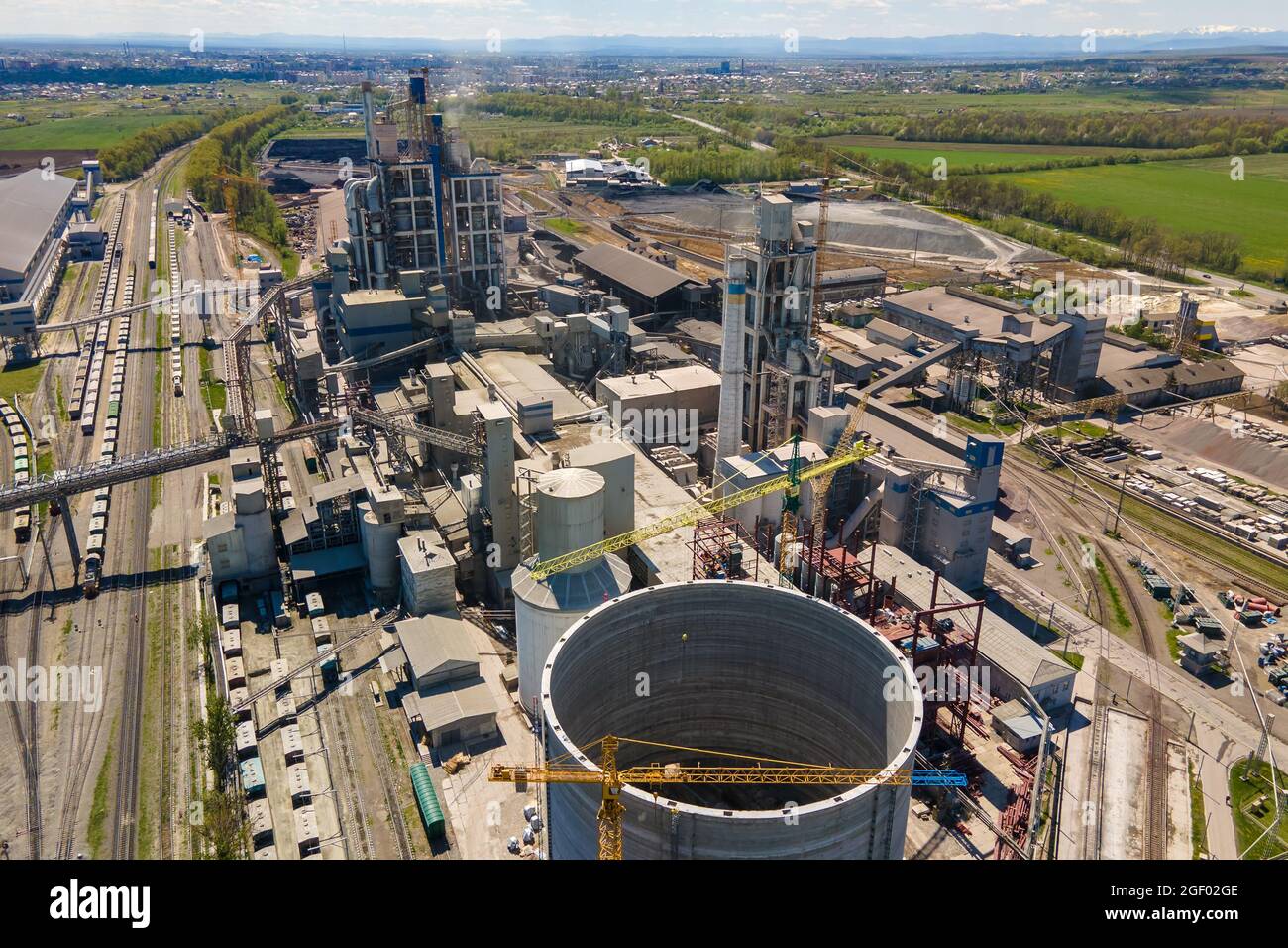 Aerial view of cement factory with high concrete structure and tower ...