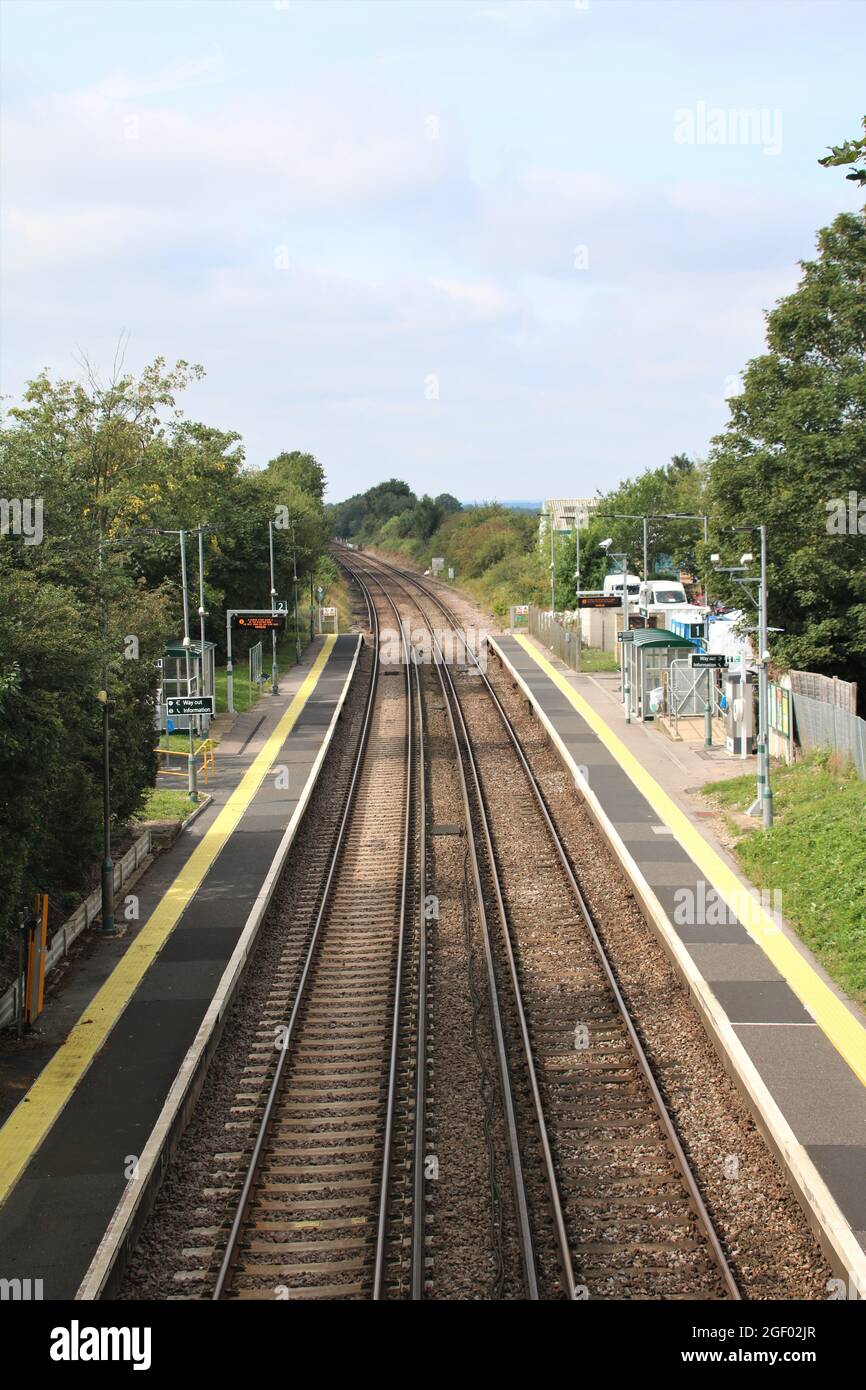 railway lines running through a deserted station Stock Photo - Alamy
