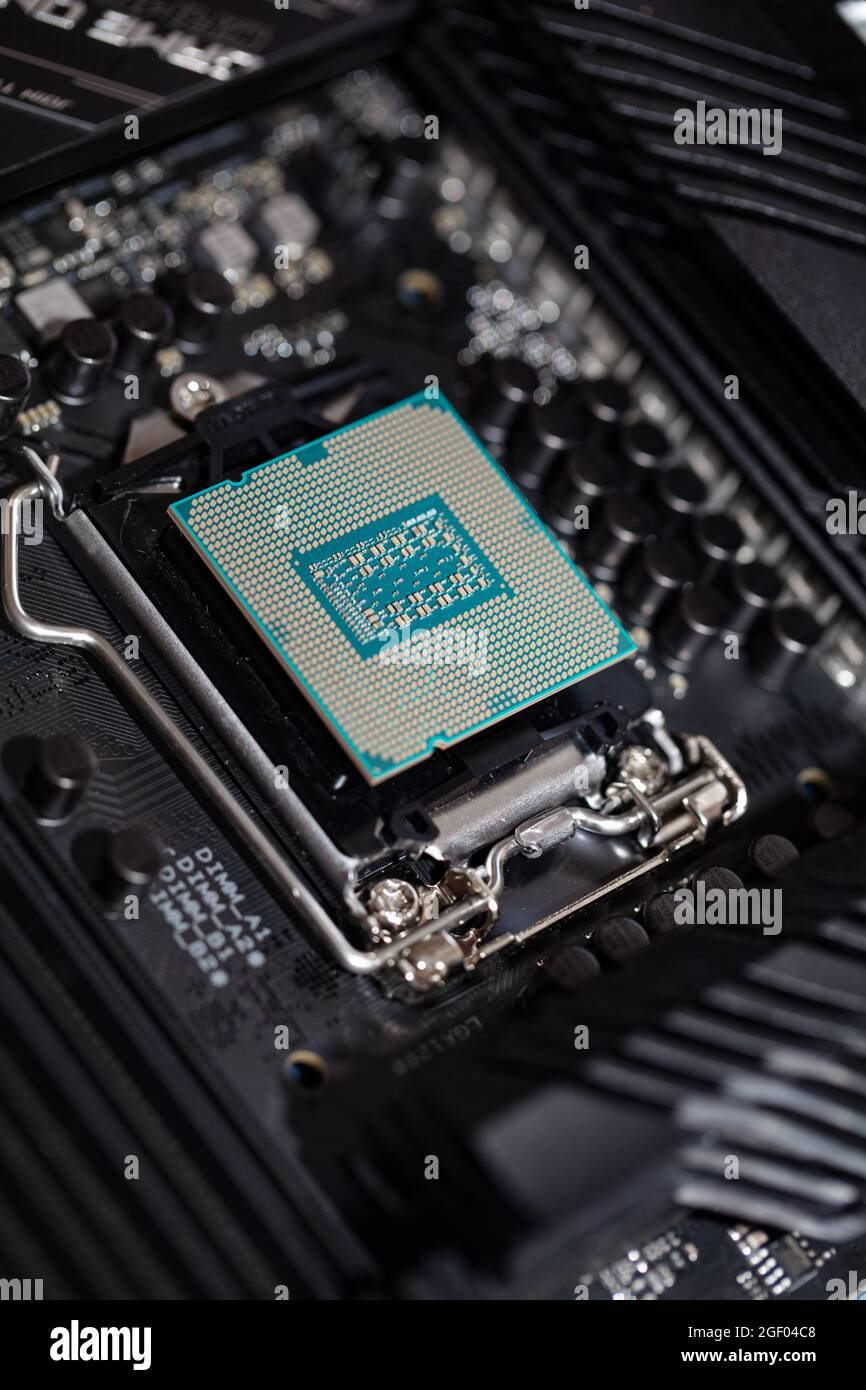 Closeup of Processor in motherboard background Stock Photo - Alamy