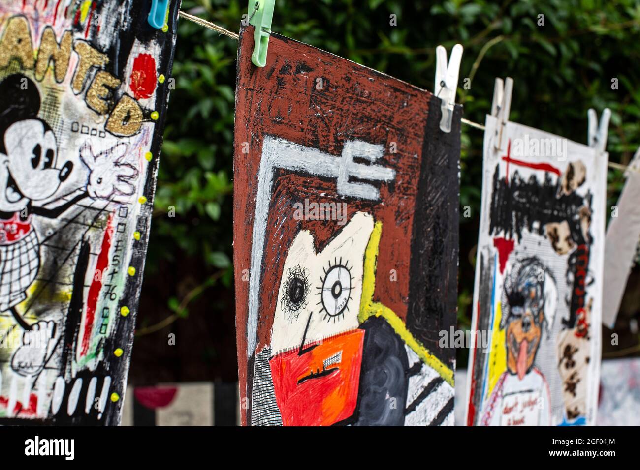 art work hanging on the washing line Stock Photo - Alamy