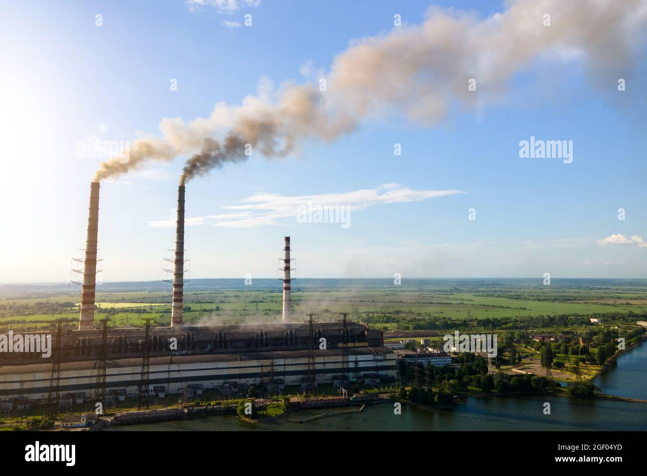 Aerial view of coal power plant high pipes with black smokestack ...