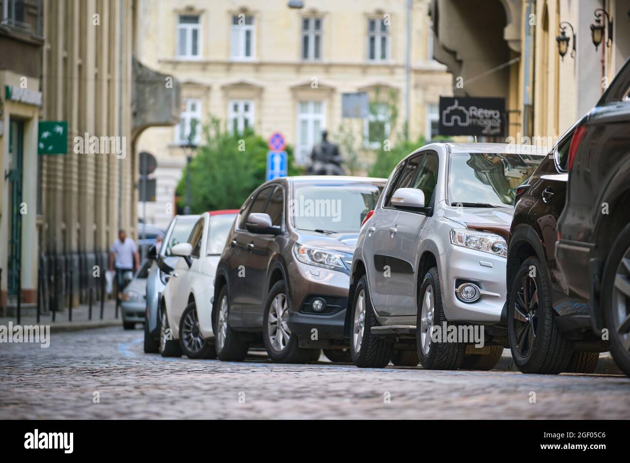 City traffic with cars parked in line on street side Stock Photo - Alamy