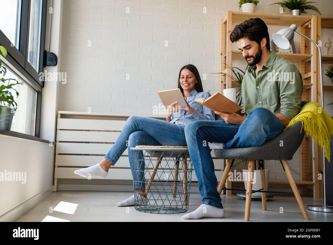 Free time together. Happy couple is spending weekend together at home ...