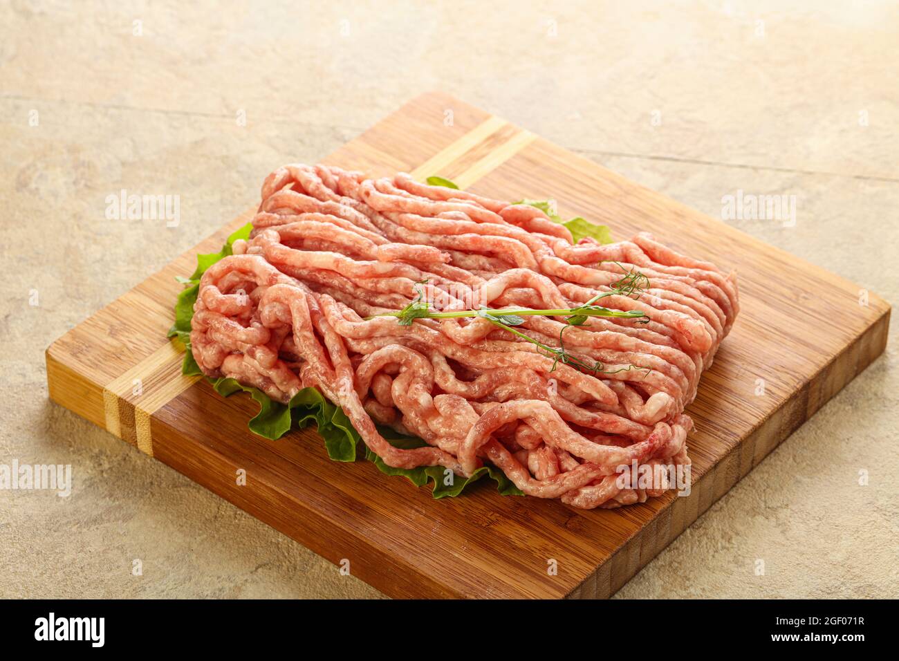 Raw minced pork meat over board for cooking Stock Photo - Alamy