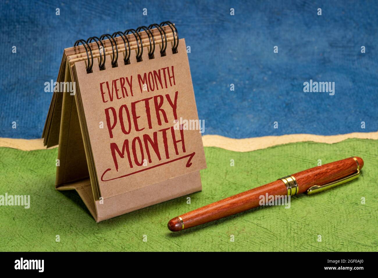 every month - poetry month, handwriting in a desktop calendar against ...