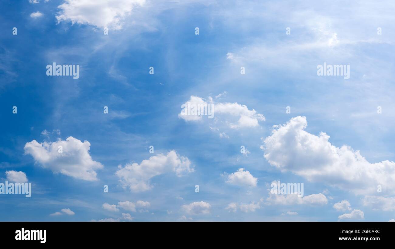 White clouds in the blue foggy sky nature background image Stock Photo ...