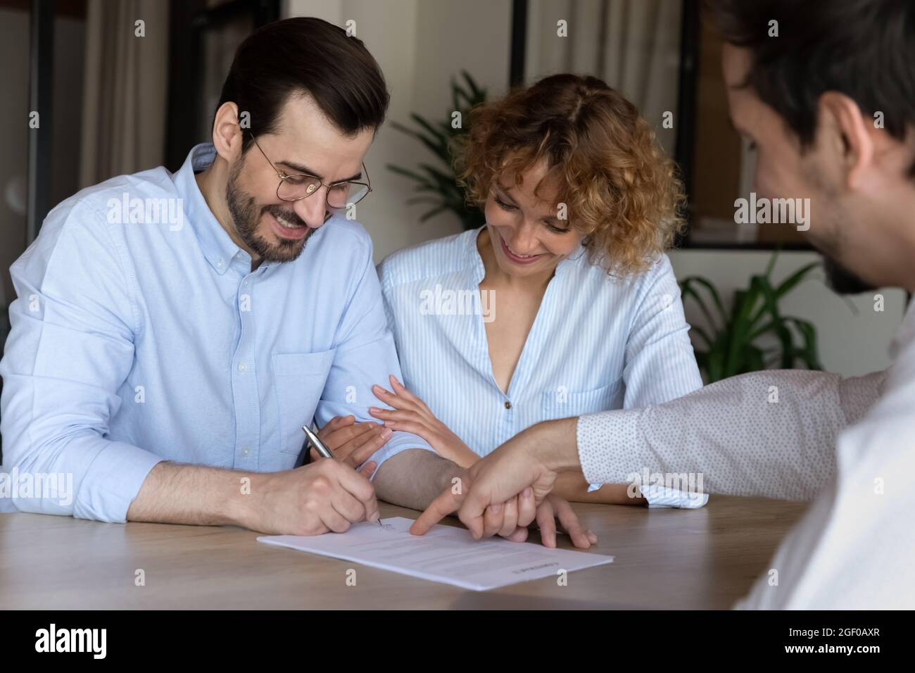 Insurance agent client sign document hi-res stock photography and ...