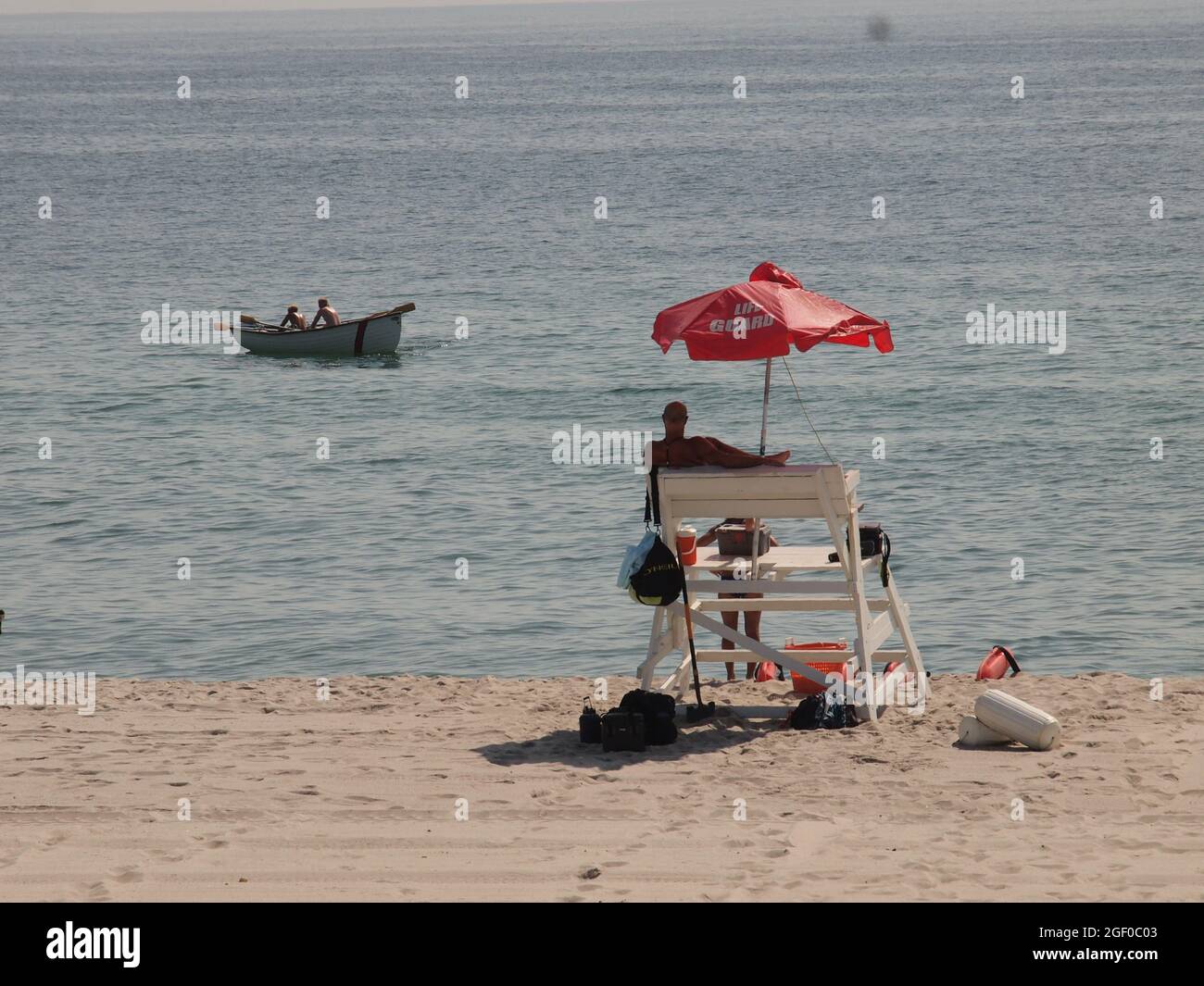 Lifeguards in rowboat off shore hi-res stock photography and images - Alamy