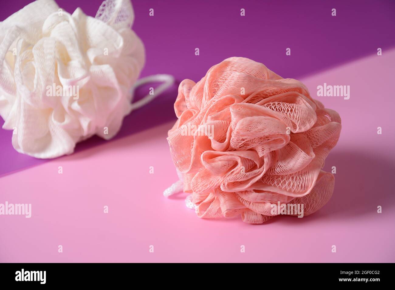 Pink mesh bath and body sponge hi-res stock photography and images - Alamy