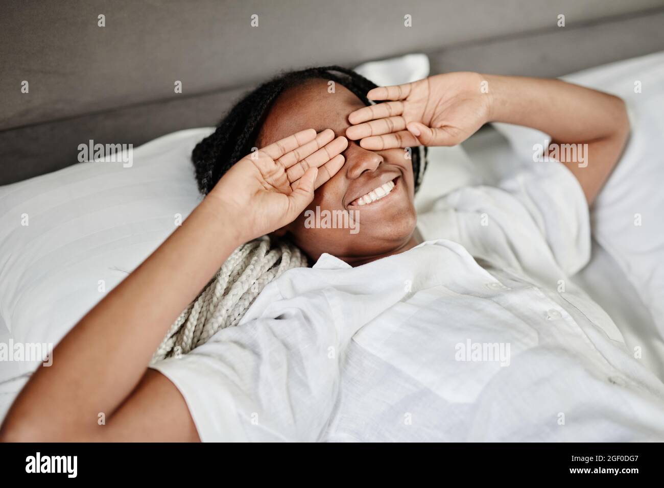 African american girl waking up in bed hi-res stock photography and ...
