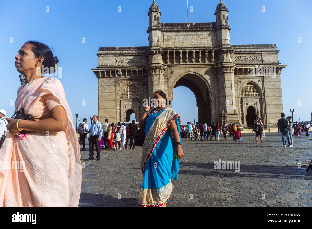 Mumbai, Maharashtra, India : Indian women walk past the Gateway of ...