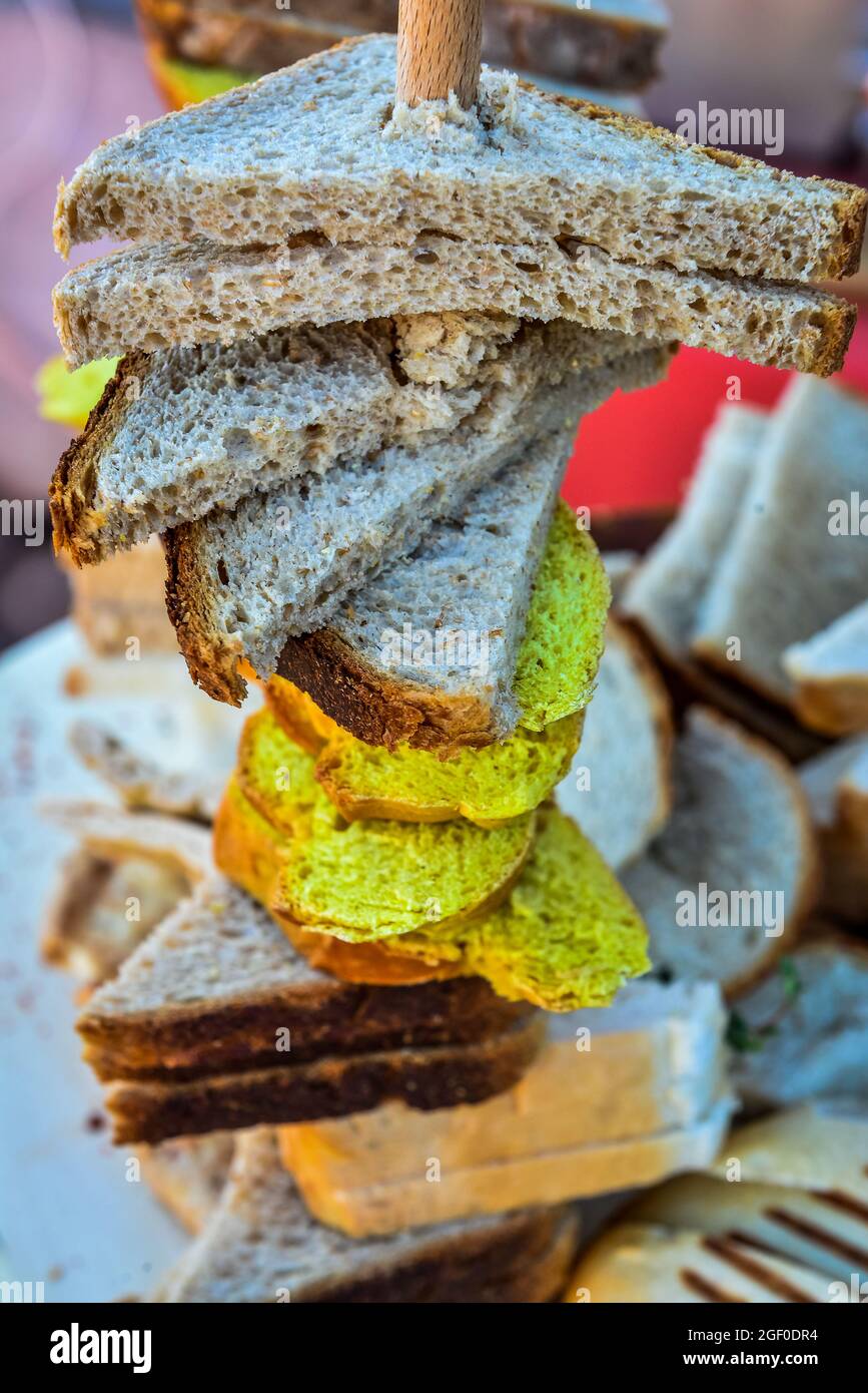 A closeup of the slices of fresh various bread stacked on each other ...