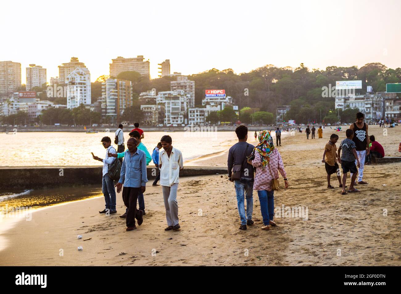Mumbai, Maharashtra, India : People stroll at sunset at Girgaon ...