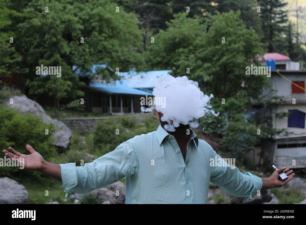 Men's face is covered with smoke Stock Photo - Alamy